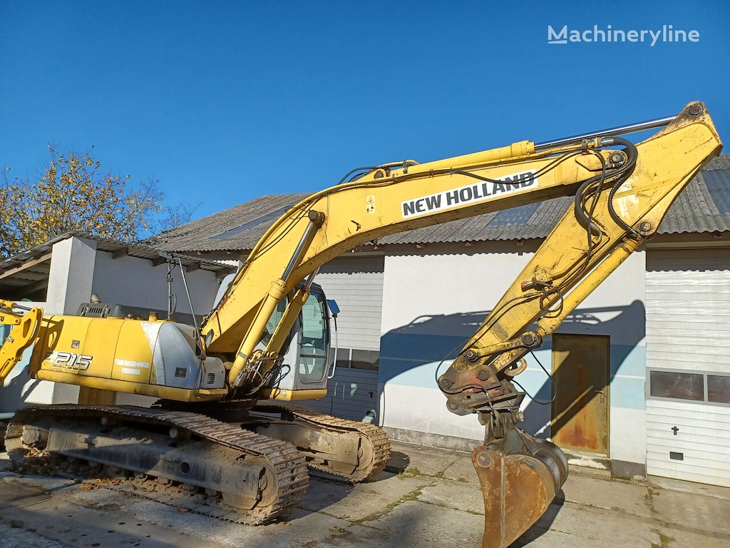 New Holland E215 bager guseničar