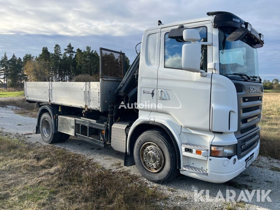 Prodaje se Scania R310 kamion s ravnom platformom na aukciji