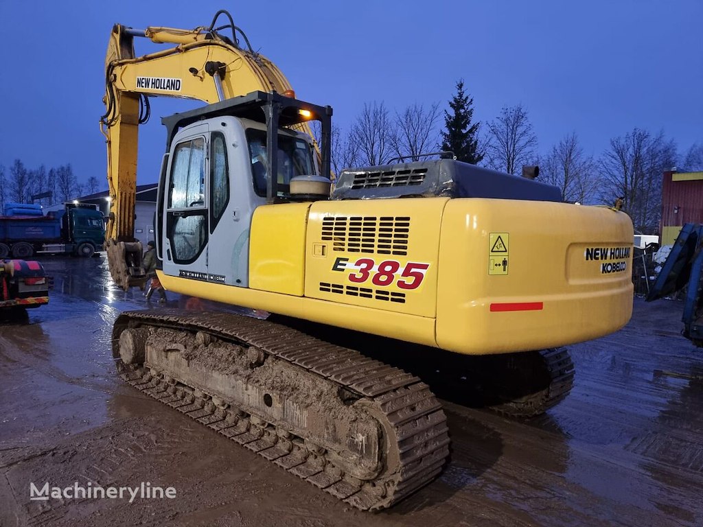 New Holland E385 bager guseničar