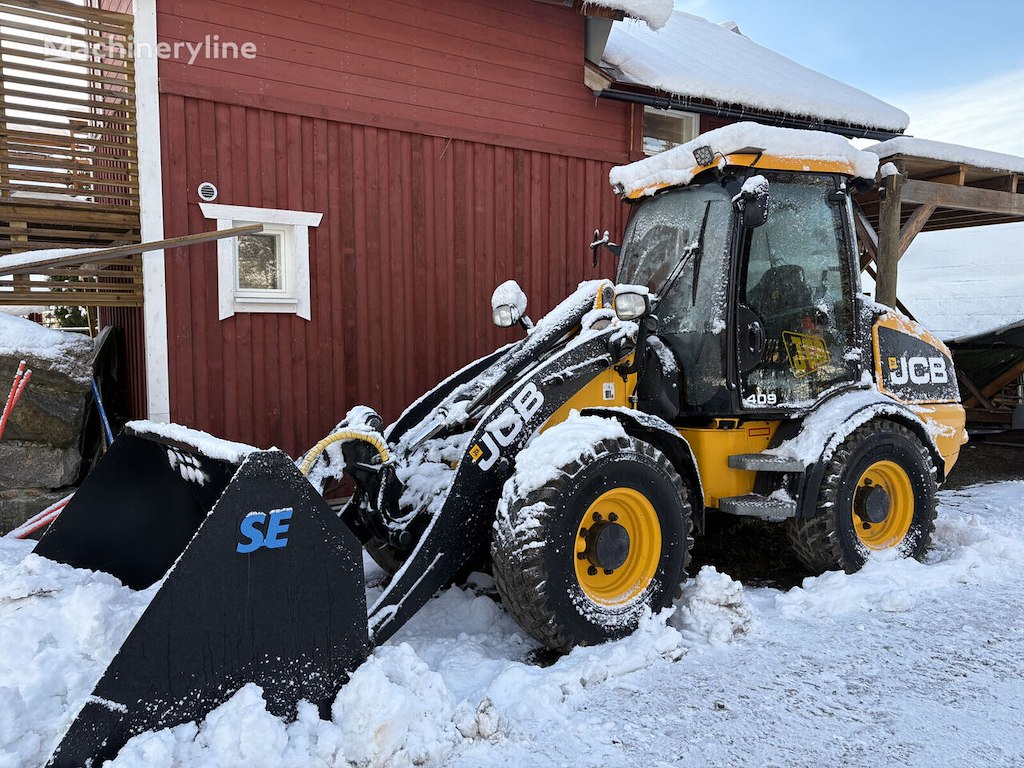 JCB 409 pyöräkuormaaja prednji utovarivač