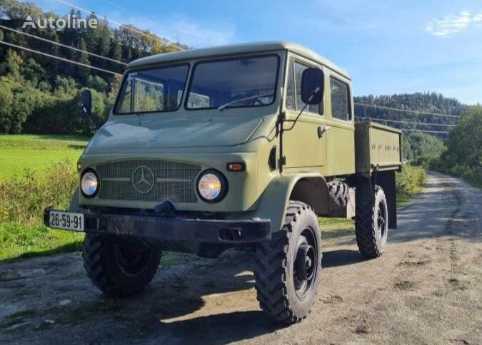 Prodaje se Mercedes-Benz Unimog 404S kamion s ravnom platformom na aukciji