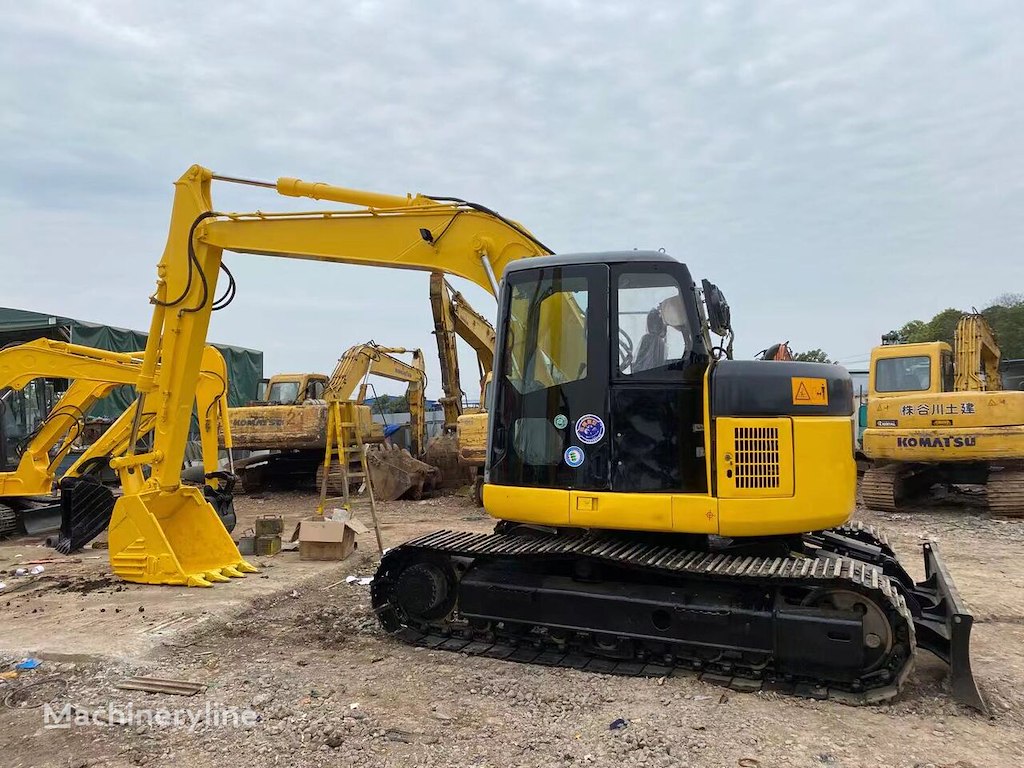 Komatsu PC128US bager guseničar