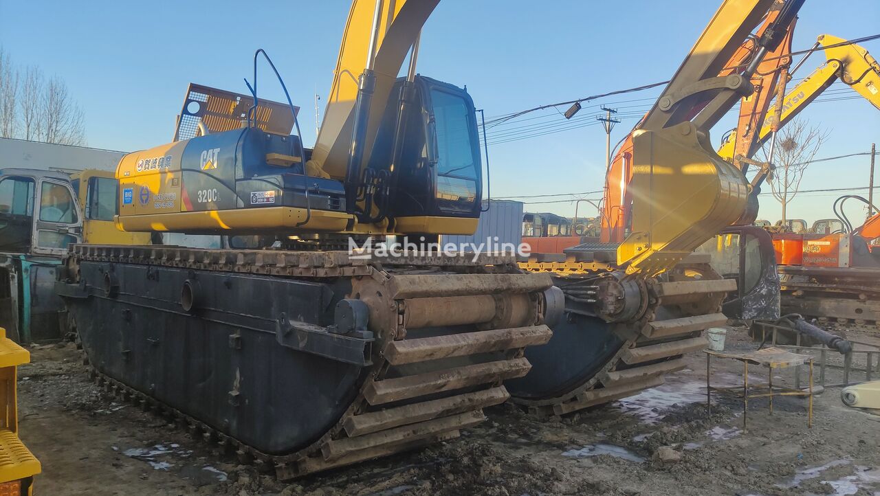 Caterpillar 320CL bager amfibija