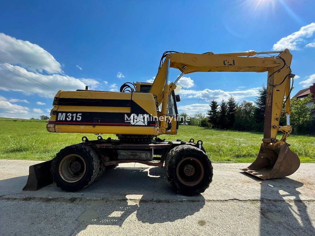 Caterpillar M315 bager točkaš