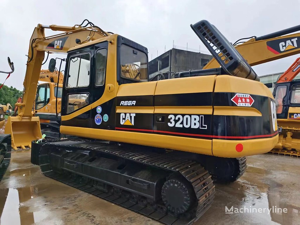 Caterpillar 320BL bager guseničar