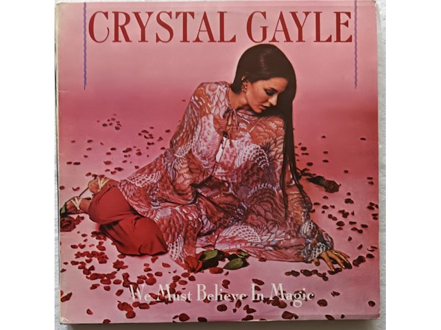 CRYSTAL  GAYLE  -  WE MUST BELIEVI IN MAGIC