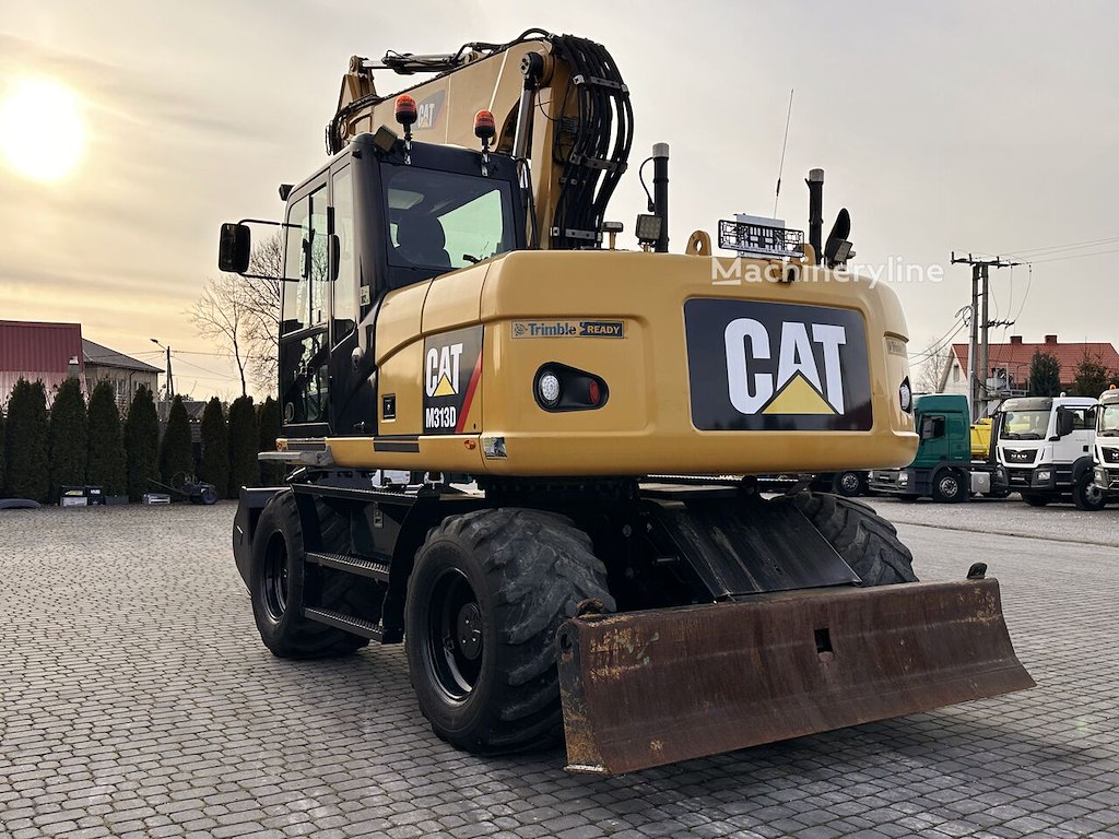 Caterpillar 313D bager točkaš