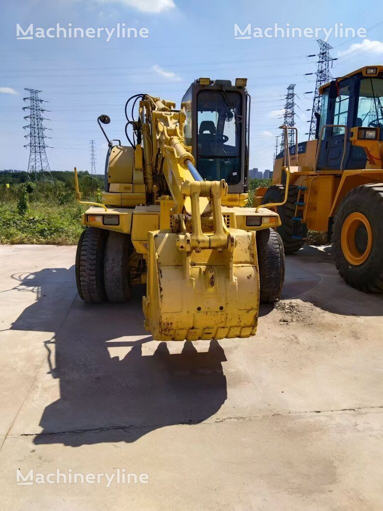 Komatsu 128US bager točkaš