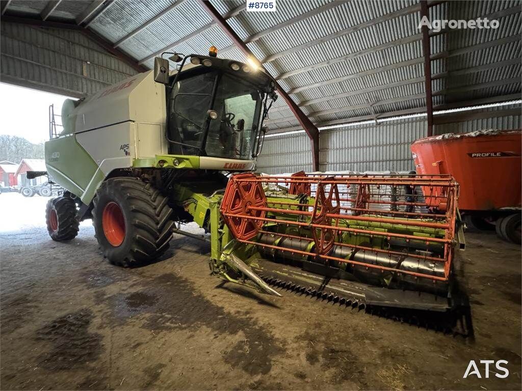 Claas Tucano 430 combine with 18-foot folding table kombajn za žito