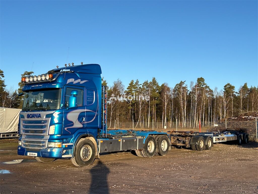 Prodaje se Scania XR20SL53-DM-L-T R500 rol kiper sa kukom na aukciji + prikolica za kontejnere