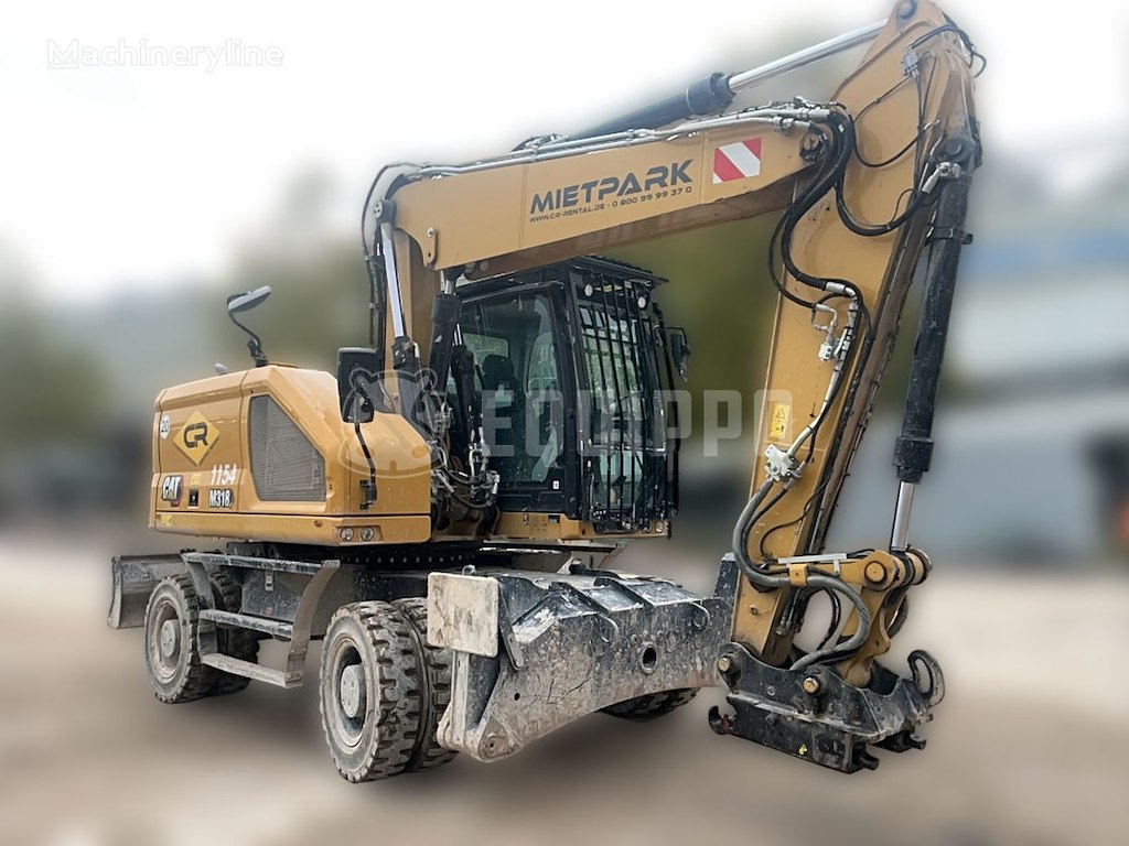 Caterpillar M318 with variable angle boom with Oilquick OQ80 quickcoupler (w bager točkaš