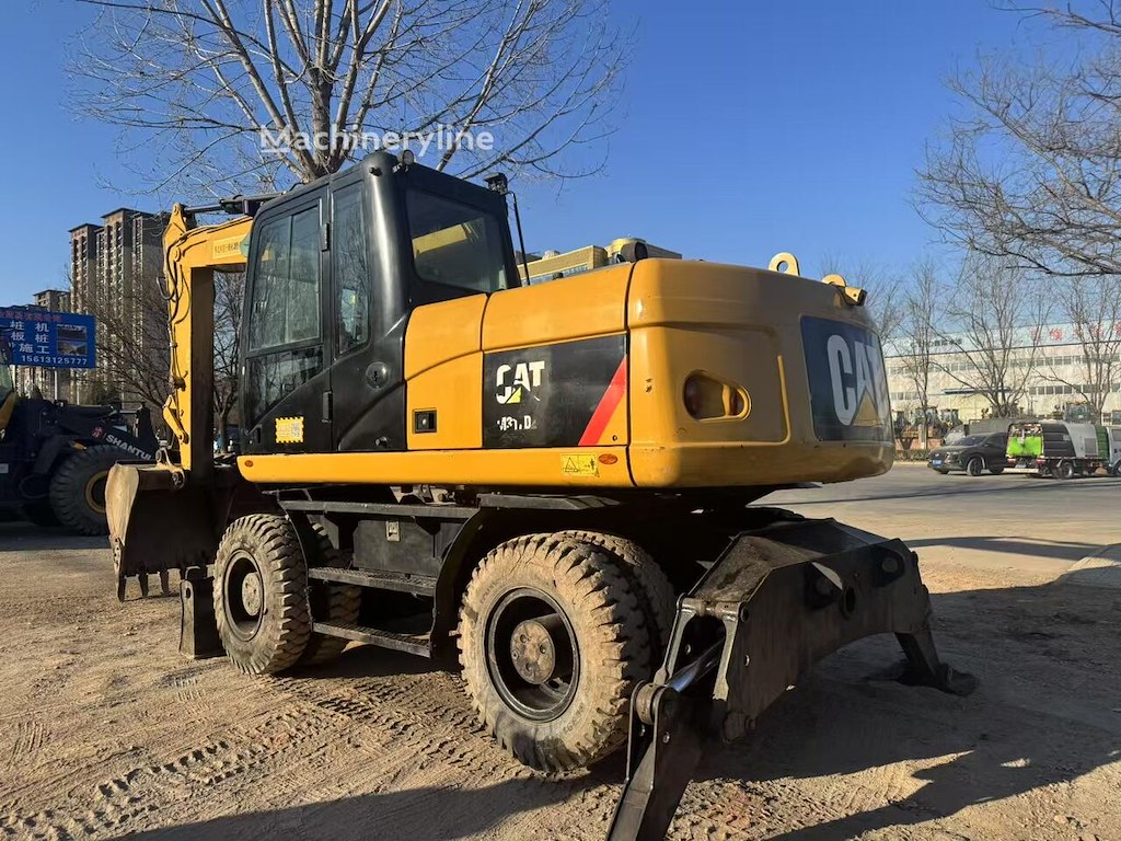 Caterpillar M317 bager točkaš