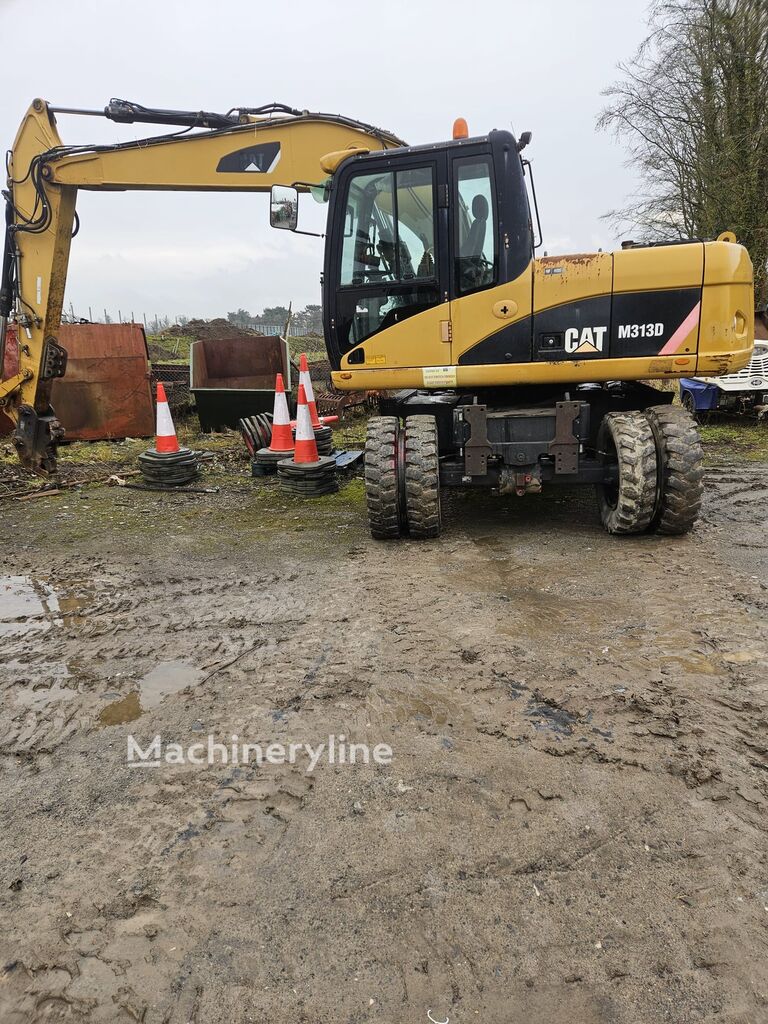 Caterpillar M313D bager točkaš