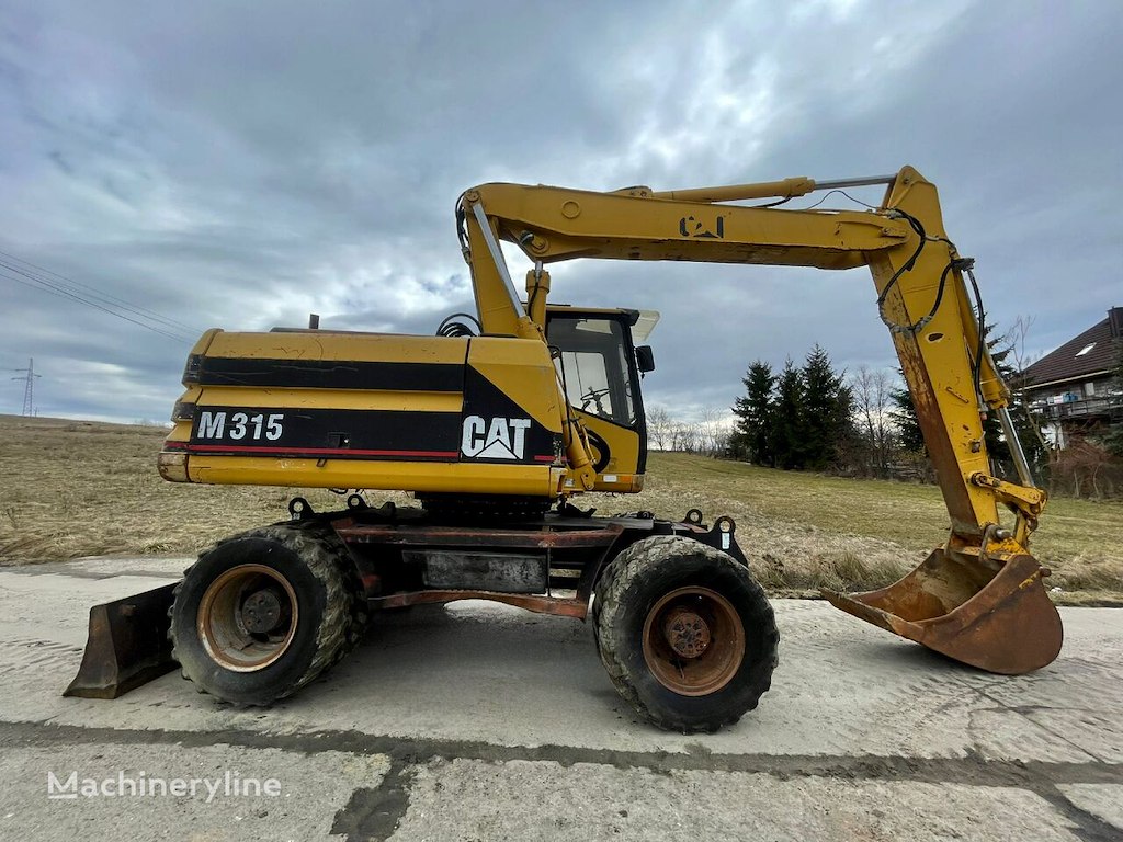 Caterpillar M315 bager točkaš