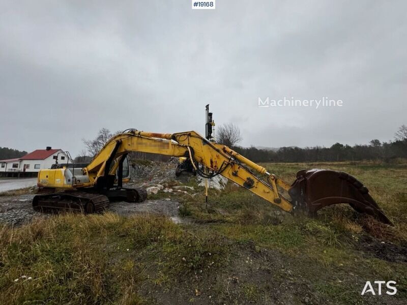 New Holland Kobelco E385 bager guseničar