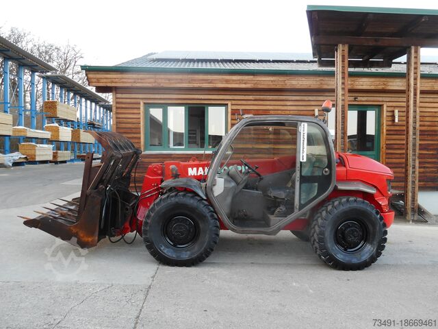 Telehandleri
Manitou MT 523 mit Greiferschaufel und Mistgabel