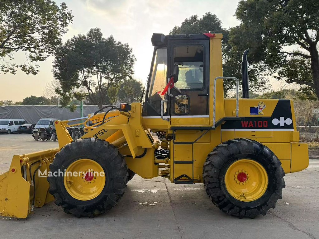 Komatsu WA100 prednji utovarivač