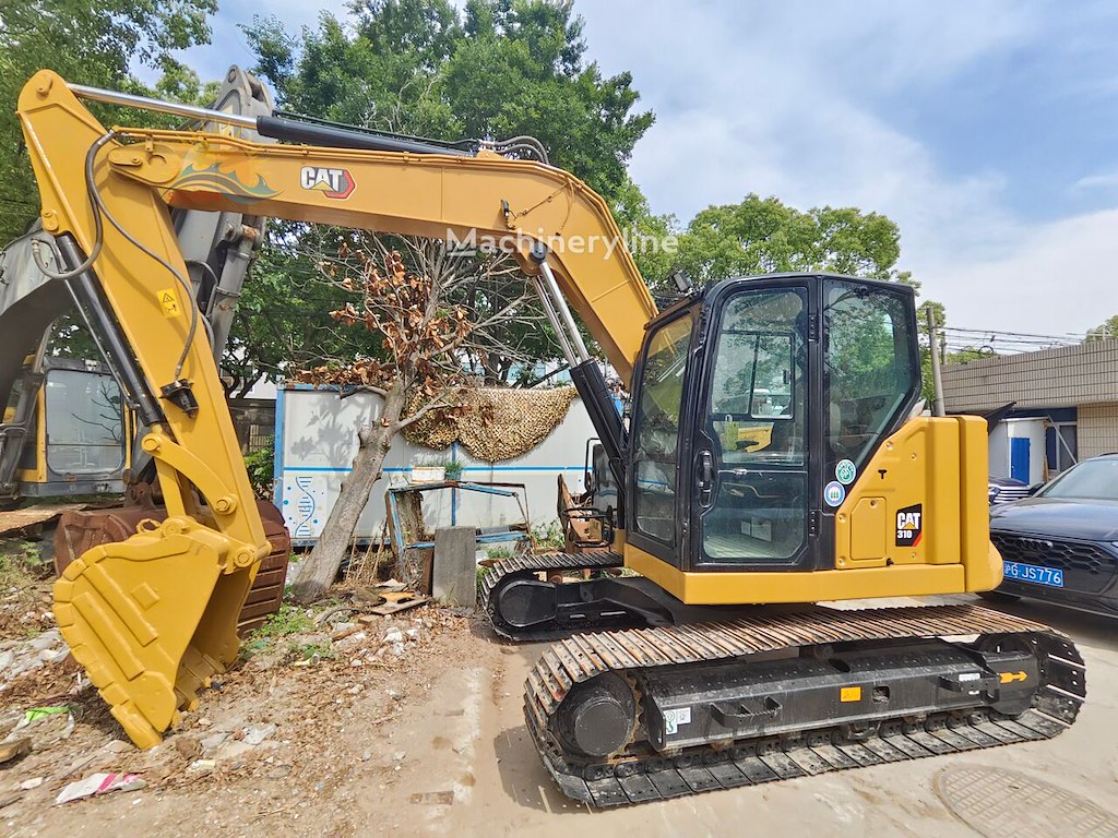 Caterpillar 310 bager guseničar