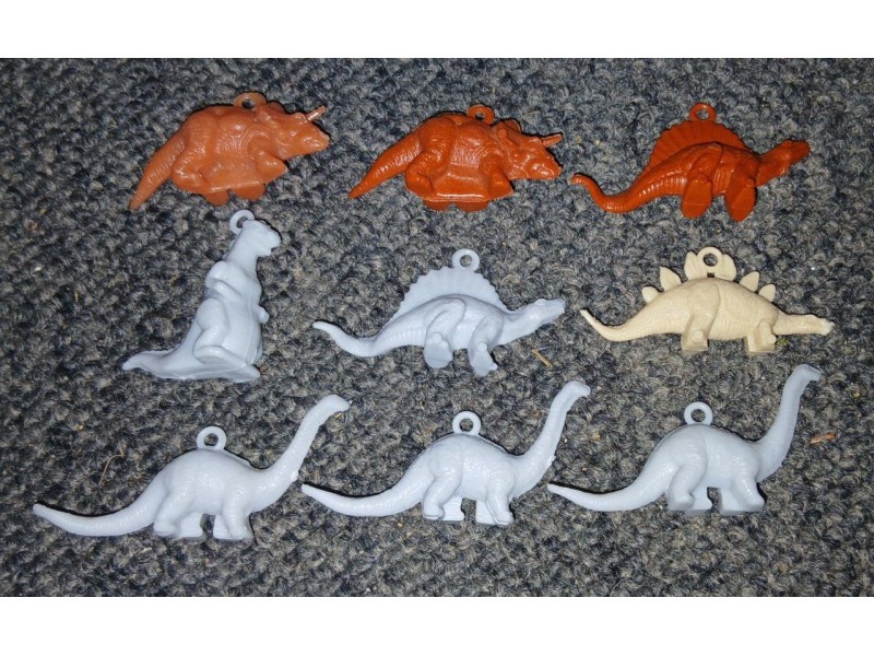 Dinosaurusi plasitčni igračke privesci