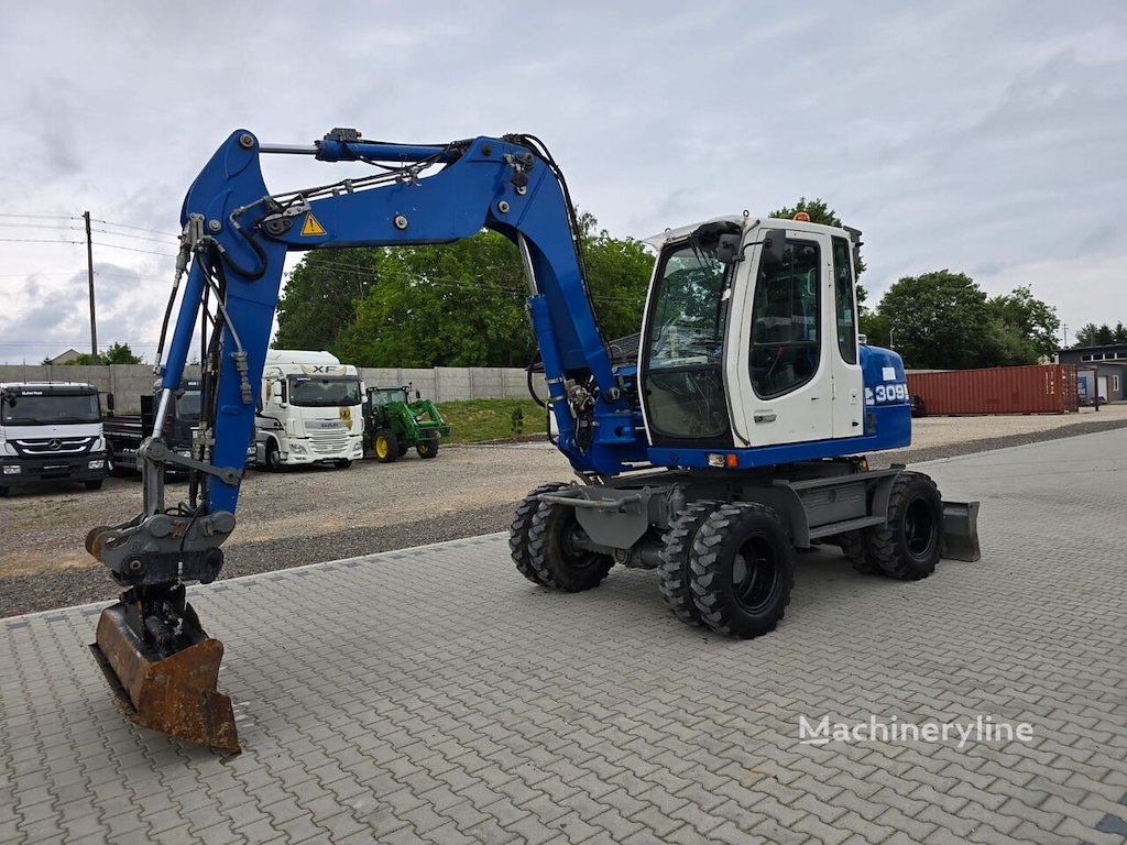 Liebherr 309 / RAMIE TRZY RAZY LAMANE bager točkaš