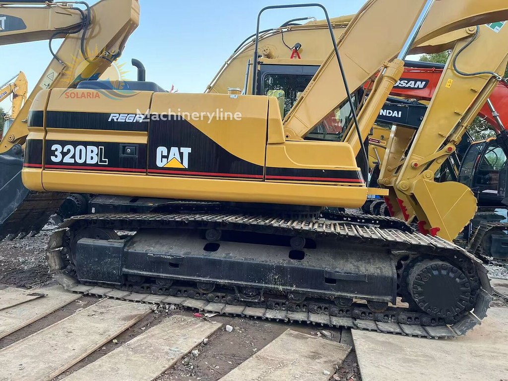 Caterpillar 320BL bager guseničar