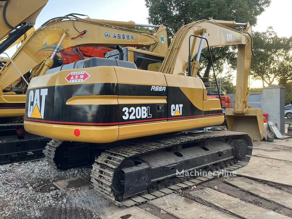 Caterpillar 320BL bager guseničar