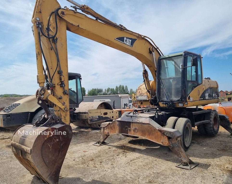 Caterpillar M316C bager točkaš