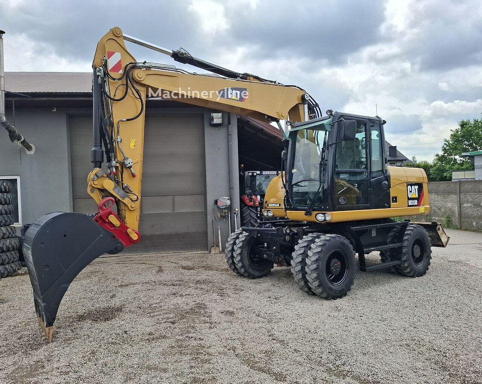 Caterpillar M313D bager točkaš