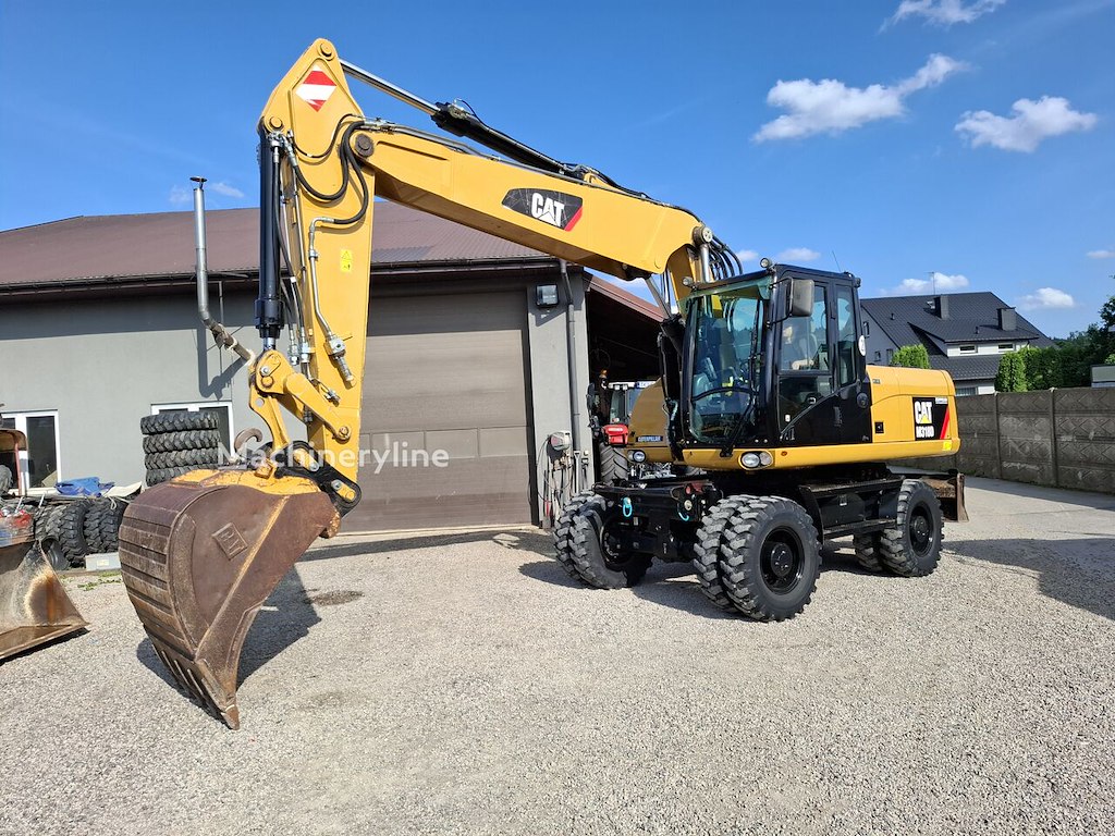 Caterpillar M318 bager točkaš