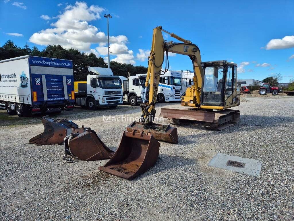 Caterpillar 307 with extra buckets midi bager