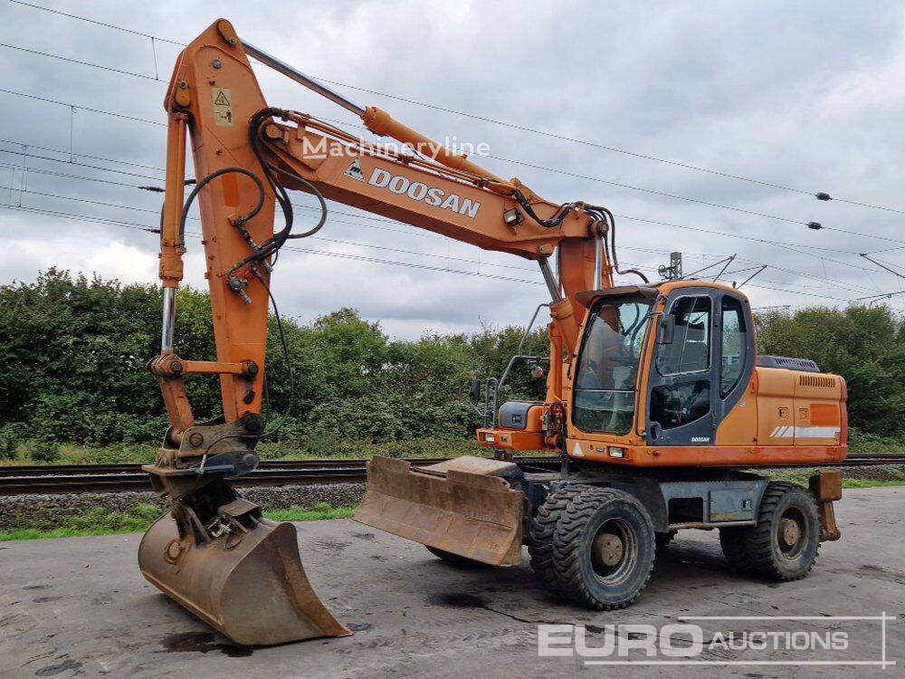 Prodaje se Doosan DX210W bager za pretovar na aukciji