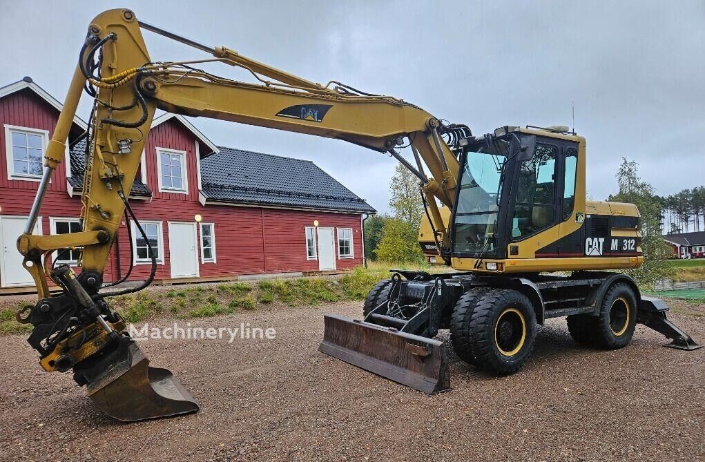 Caterpillar M312 Engcon EC20 tiltrotator bager točkaš