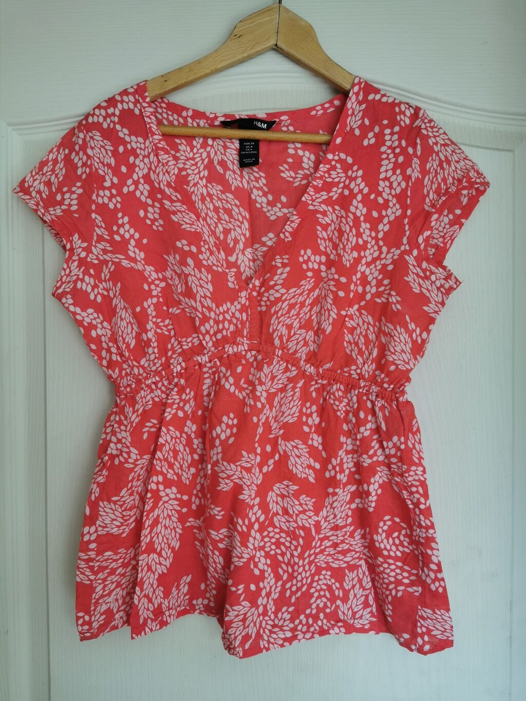 H&M ženska bluza bez rukava u crveno-beloj kombinaciji. - Model