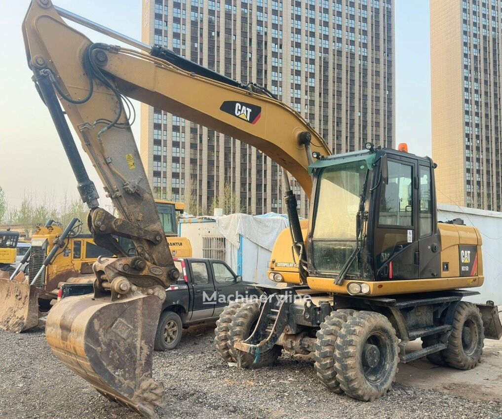 Caterpillar M315 bager točkaš