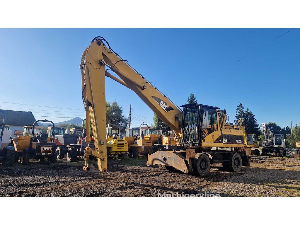 Prodaje se Caterpillar M322C bager za pretovar na aukciji