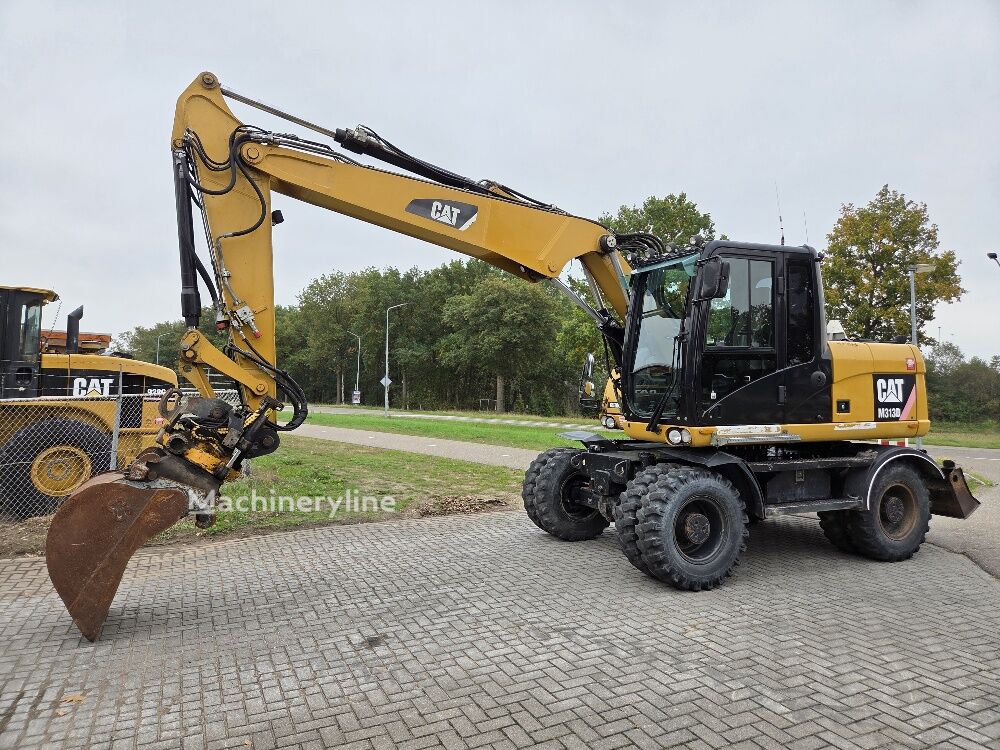 Caterpillar M313D bager točkaš