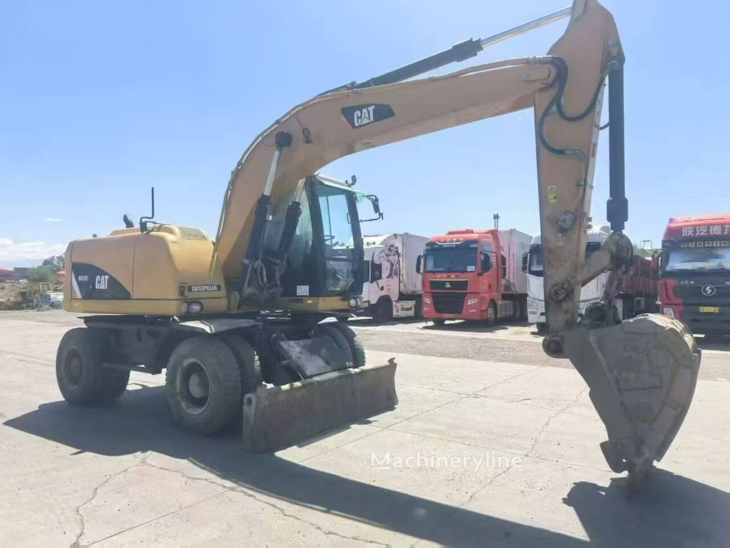 Caterpillar M315D2 bager točkaš