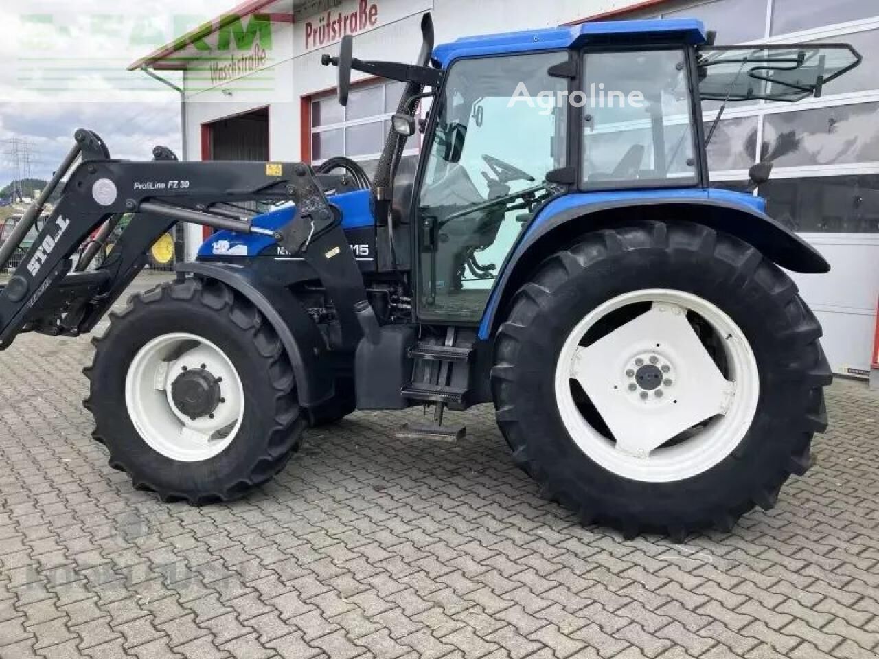 New Holland ts 115 traktor točkaš