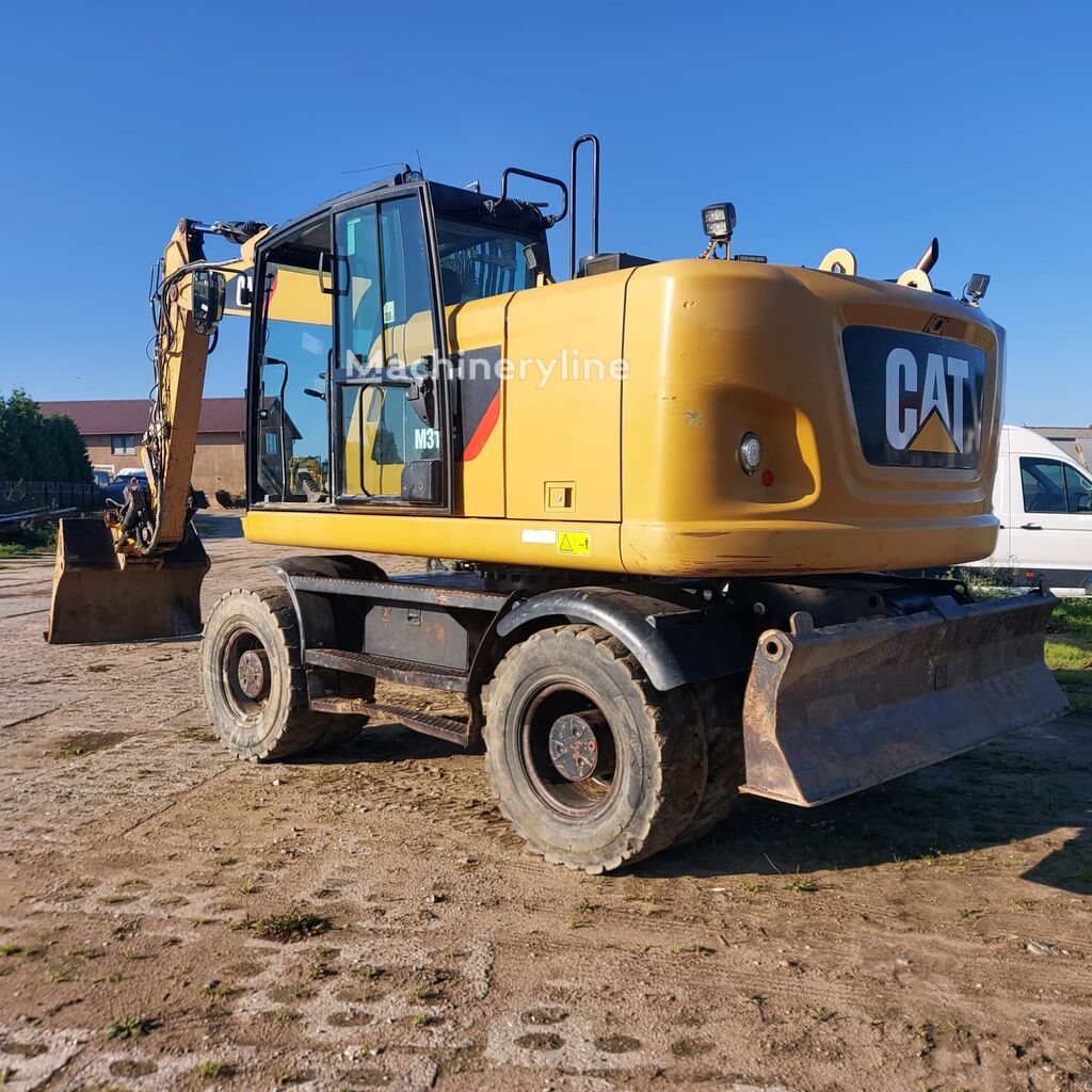 Caterpillar M318F bager točkaš