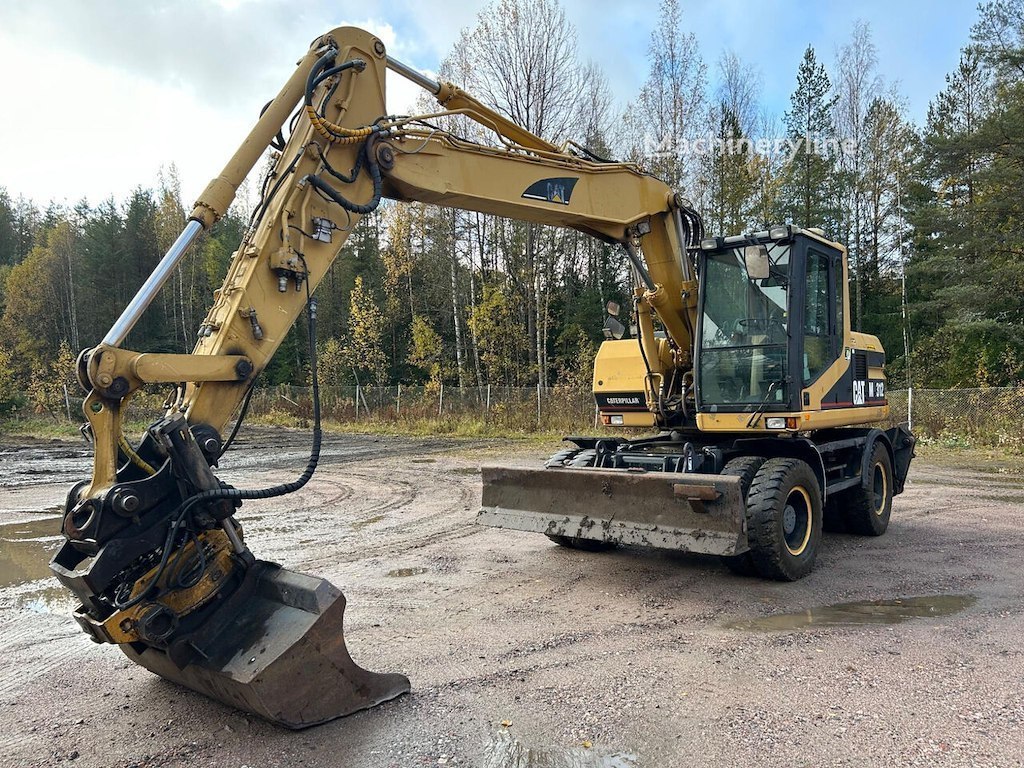 Caterpillar M312 Engcon EC20 tiltrotator bager točkaš