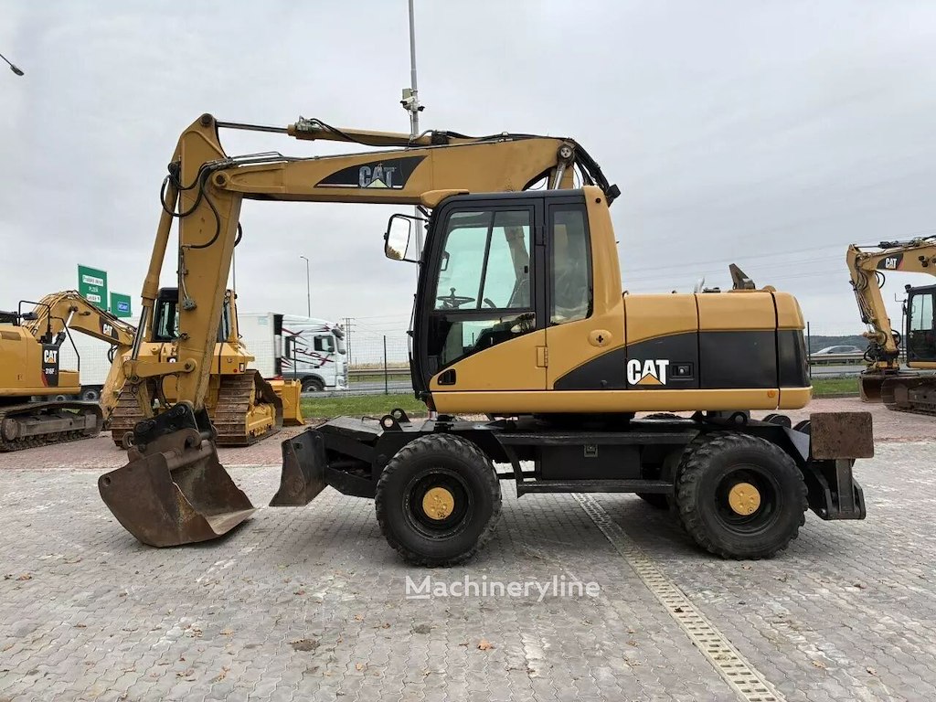 Caterpillar M313C bager točkaš