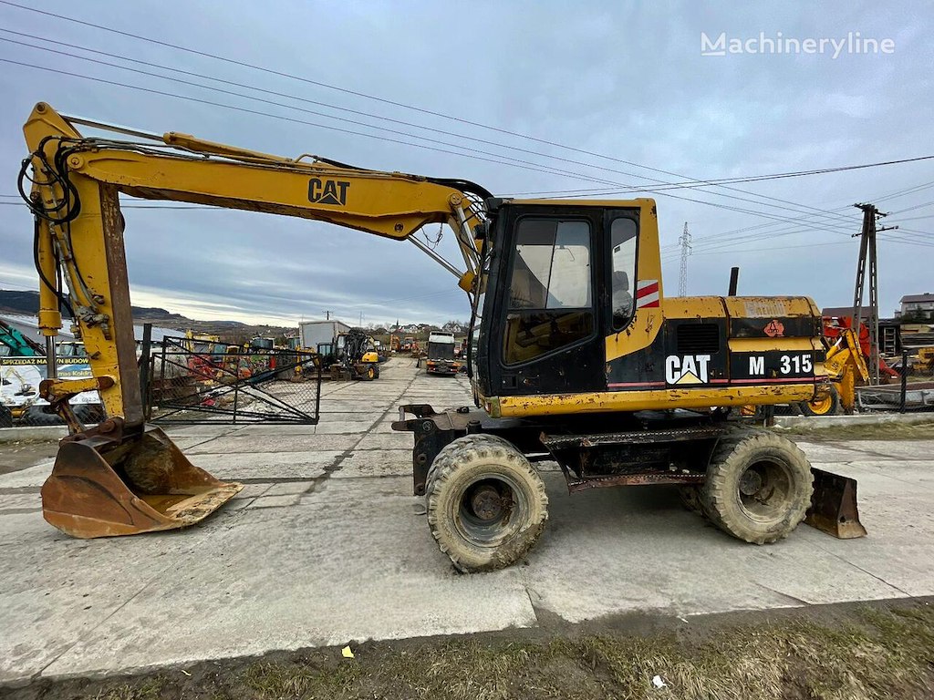 Caterpillar M315 bager točkaš