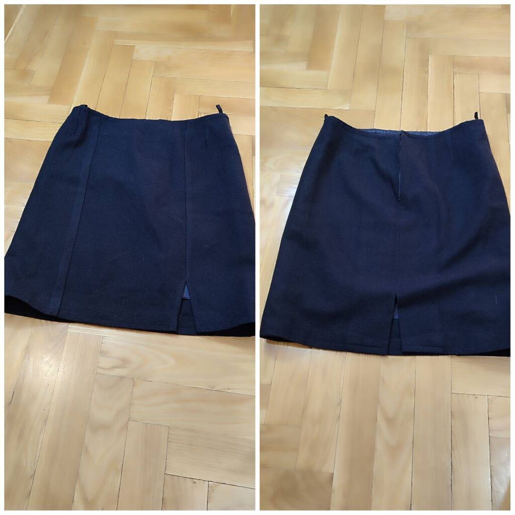 Crna topla suknja sa postavom. Klasičan kroj do kolena, sa diskretnim