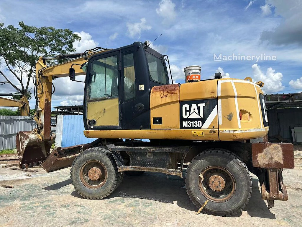 Caterpillar 313D bager točkaš