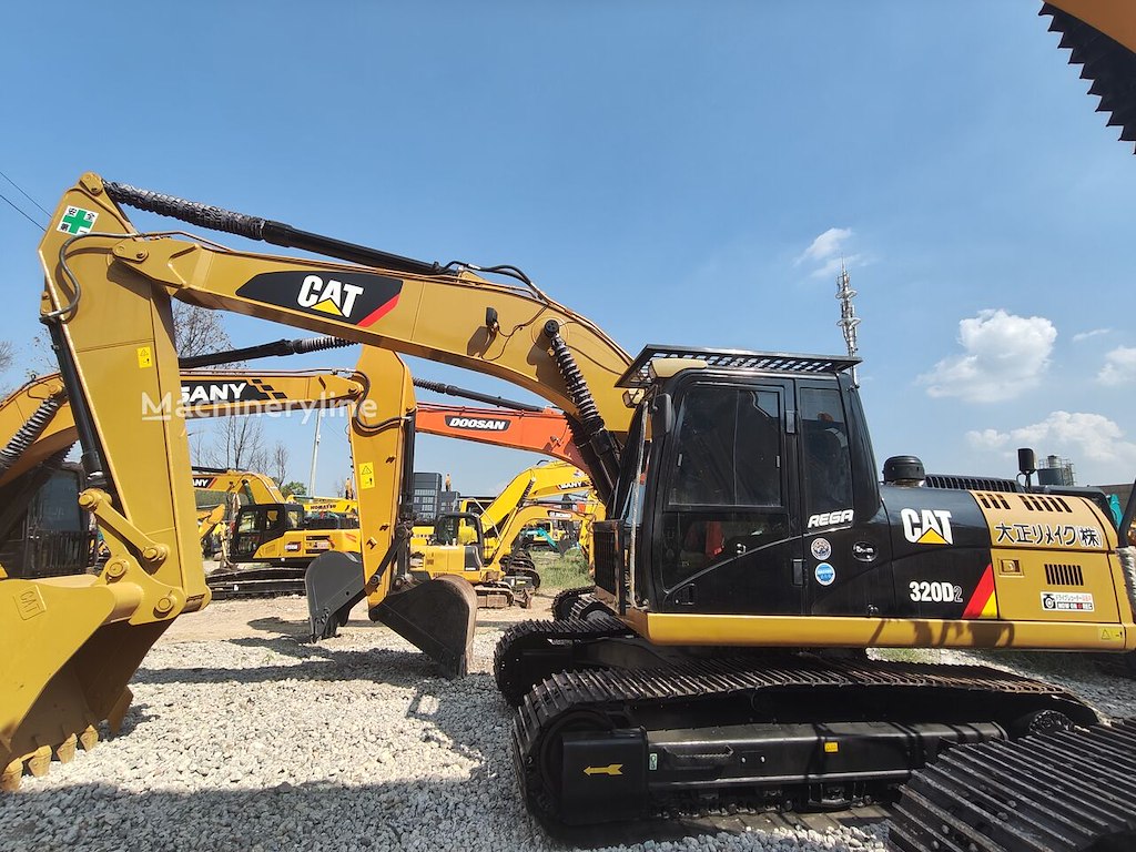 Caterpillar 320DL bager guseničar