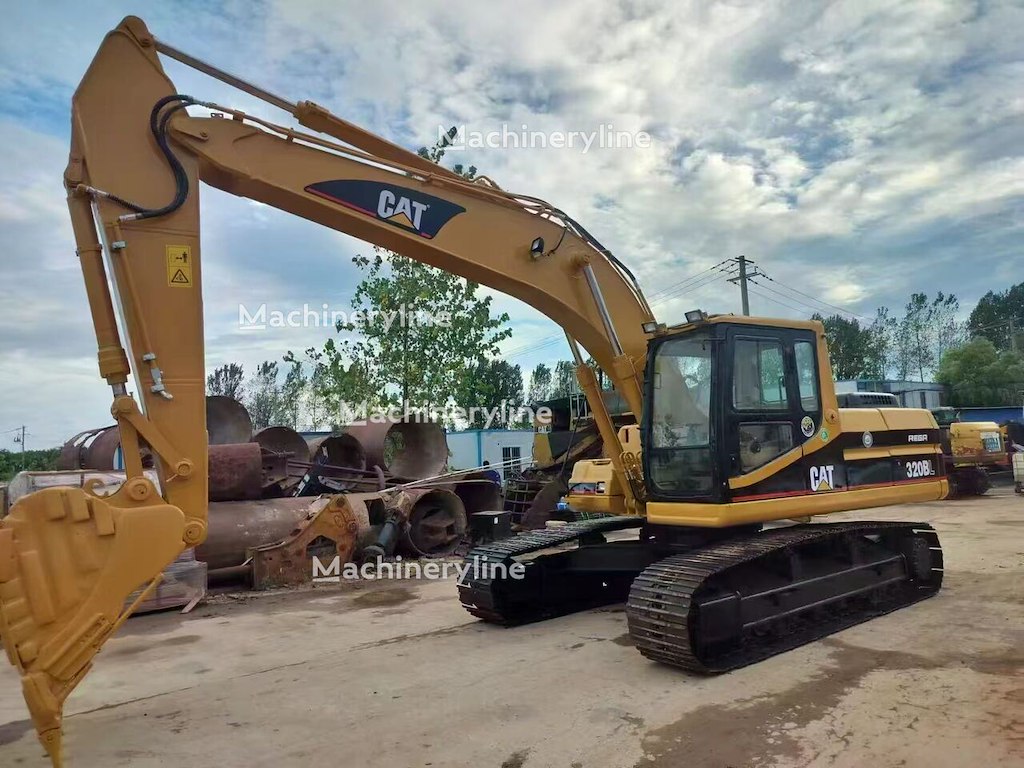 Caterpillar 320BL bager guseničar