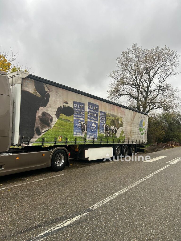 Schmitz Cargobull 2 osie podnoszone poluprikolica s ceradom