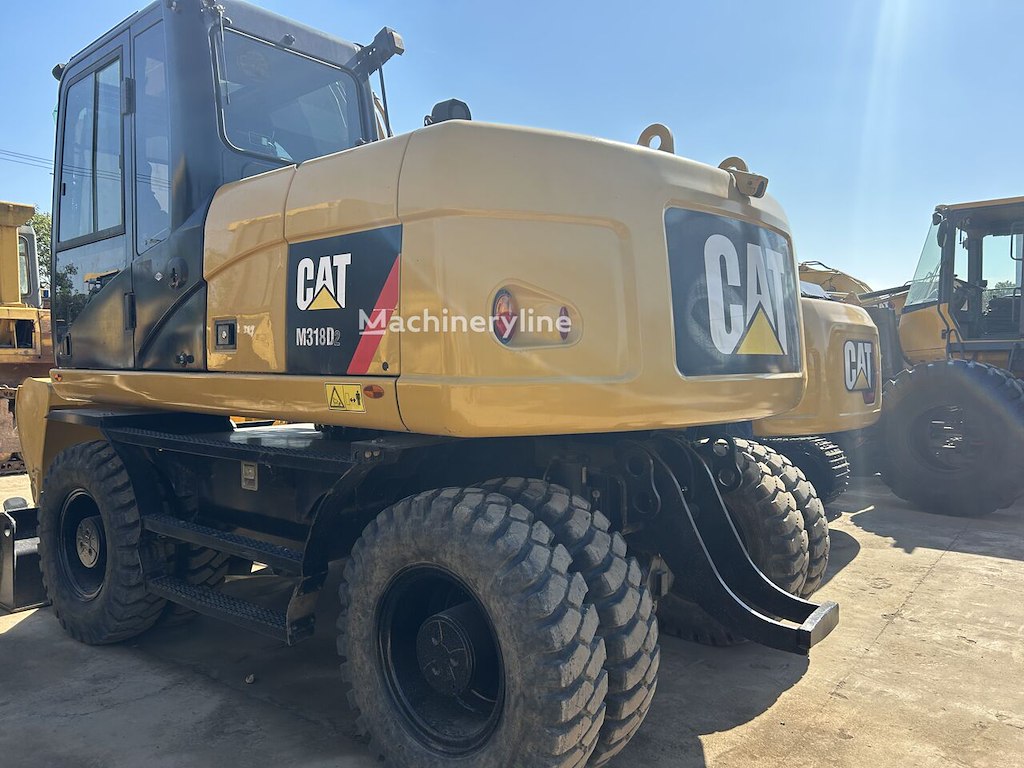 Caterpillar M318D2 bager točkaš