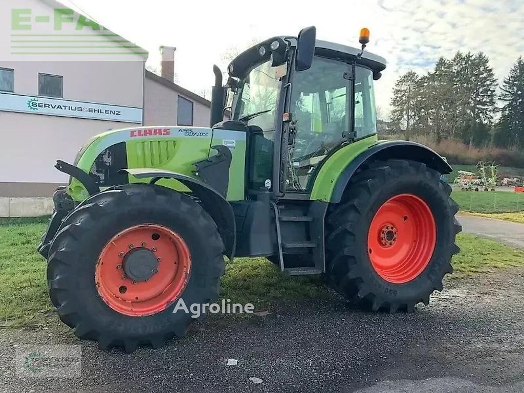 Claas ares 697 atz mit fronthydraulik und frontladerkonsolen stoll ATZ traktor točkaš