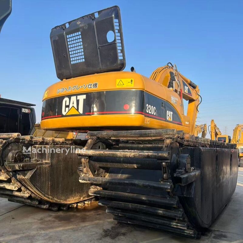 Caterpillar 320C bager amfibija